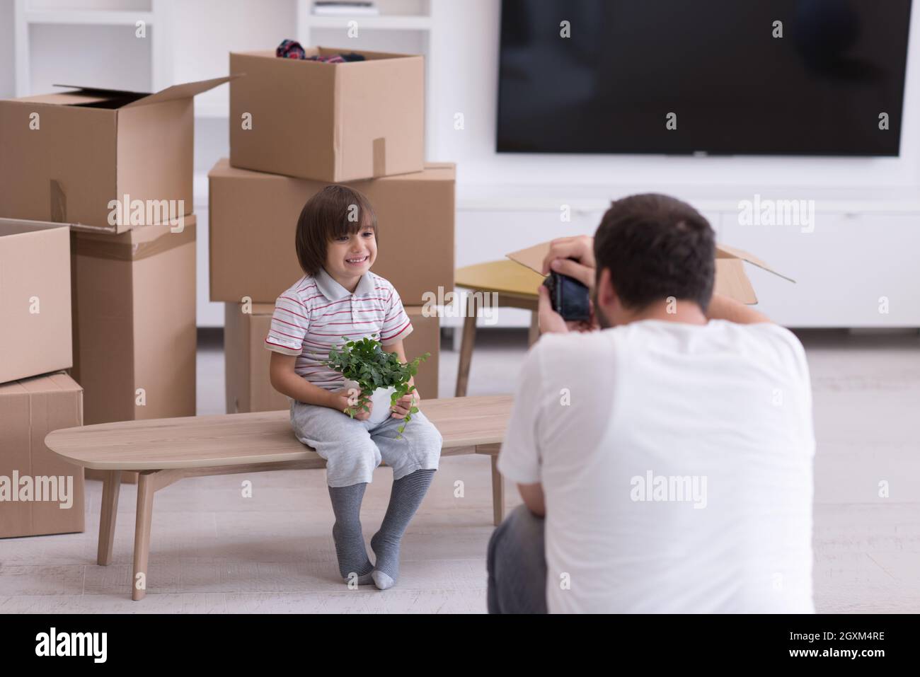 Photoshooting with kid model at studio as new modern home Stock Photo ...