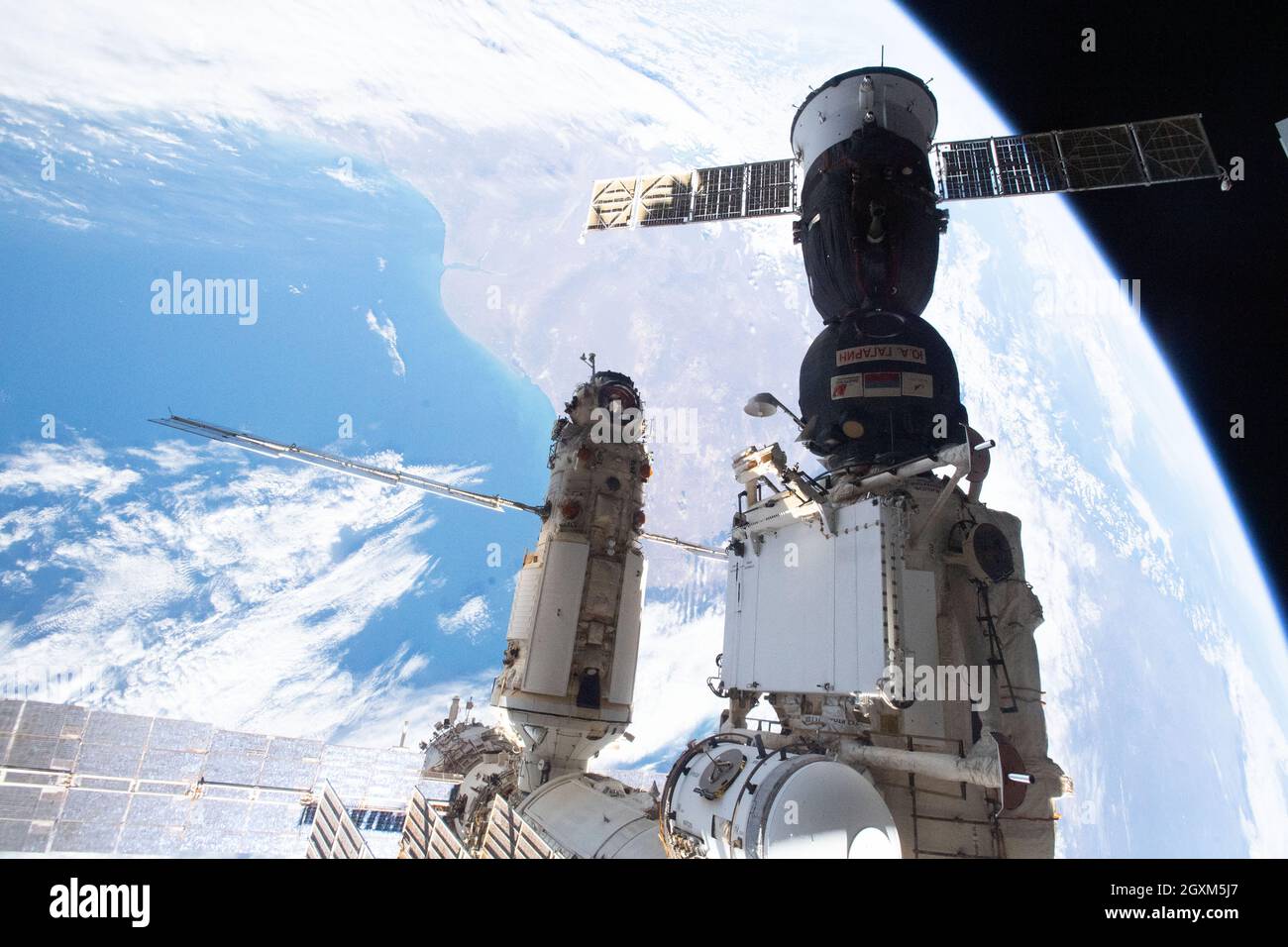 The Russian Soyuz MS-18 spacecraft carrying three Expedition 65 crew ...