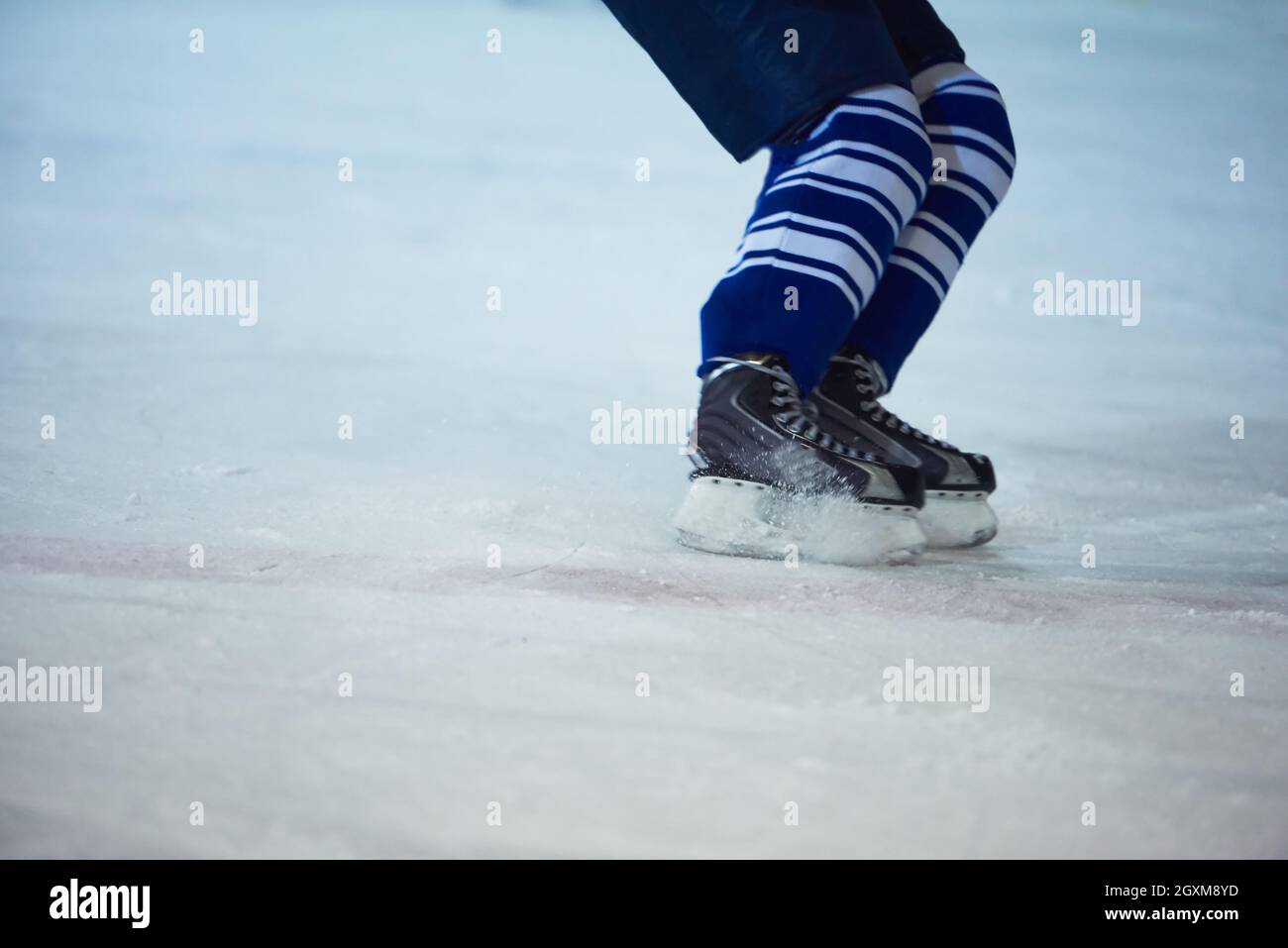 ice hockey player in action kicking with stick Stock Photo - Alamy