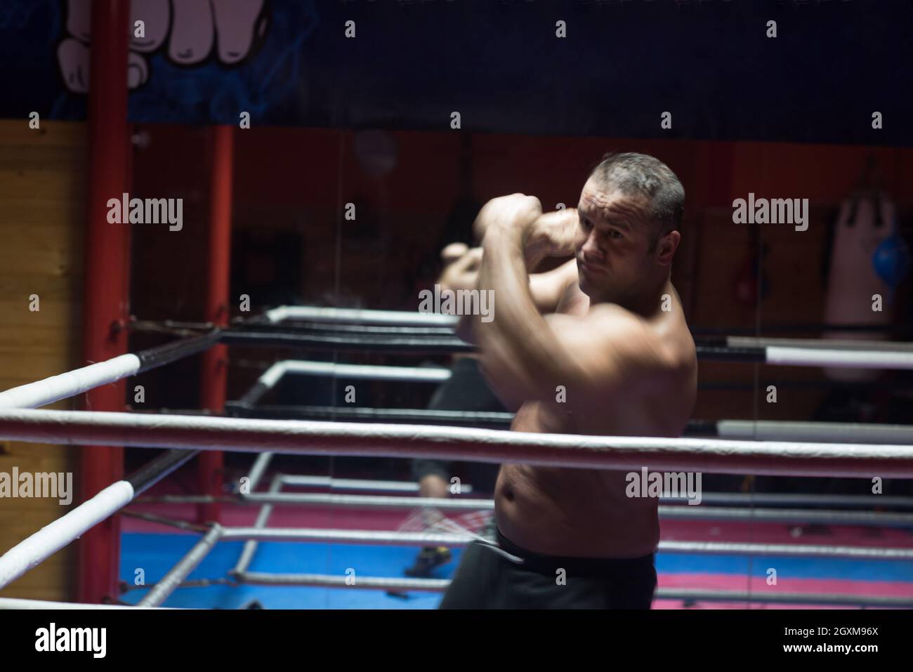 professional kickboxer with hands in martial arts position training for ...