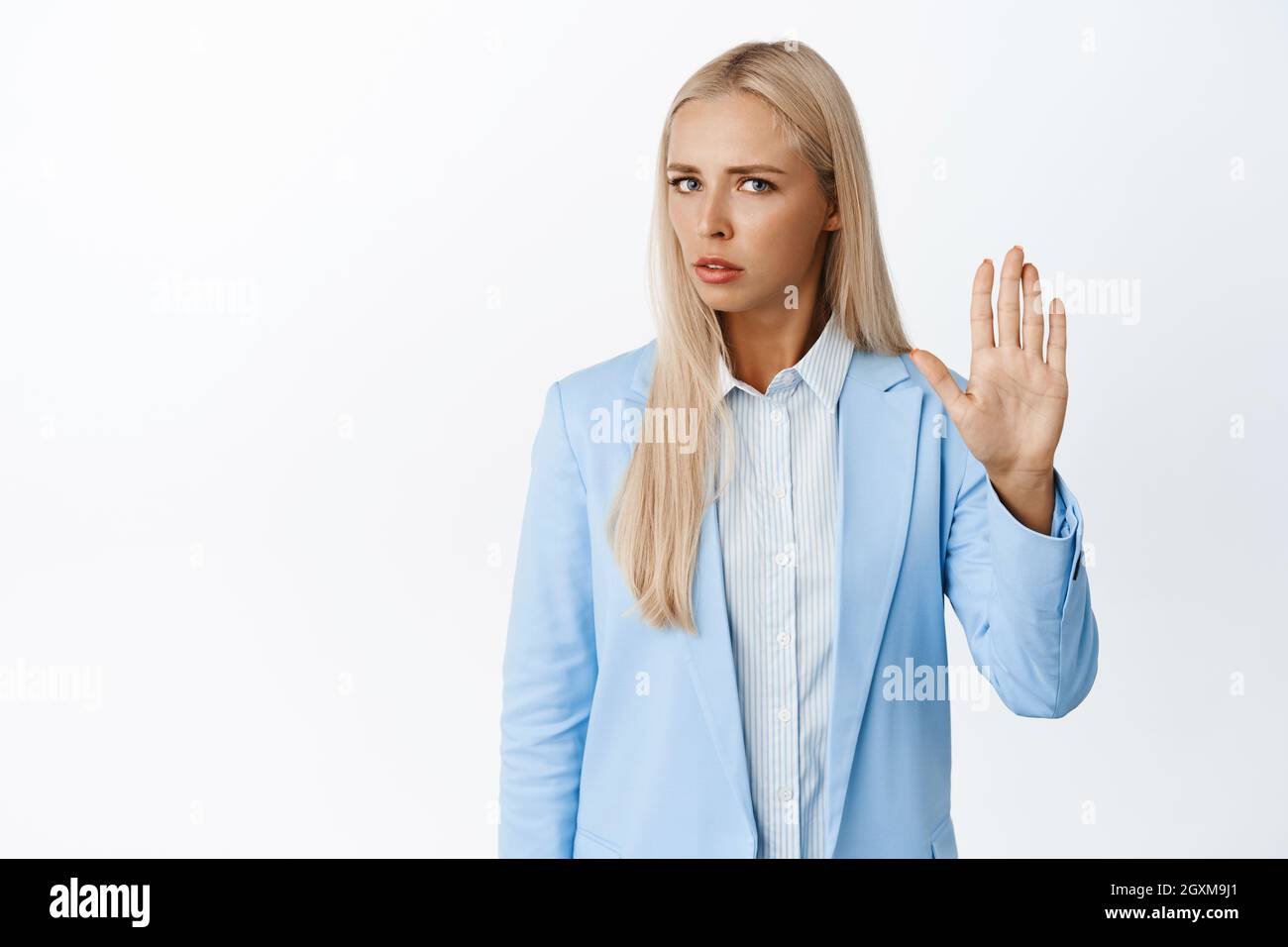 Image of successful young businesswoman showing stop sign, raising one ...