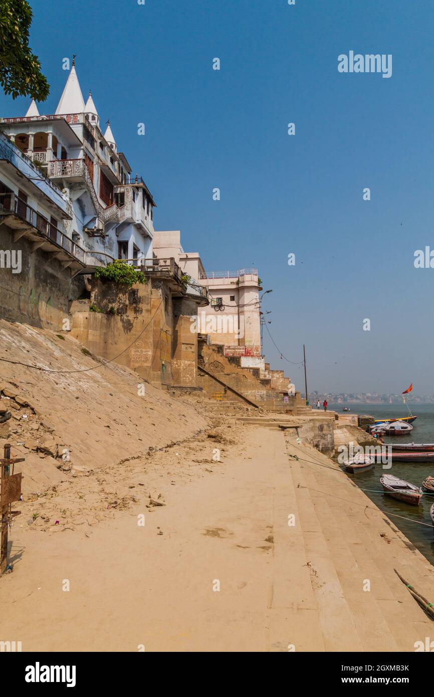 View of Ghats riverfront steps leading to the banks of the River Ganges ...