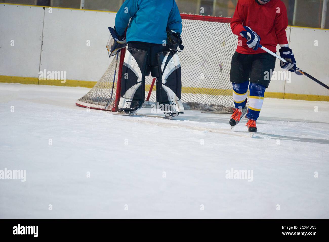 ice hockey player in action kicking with stick Stock Photo - Alamy