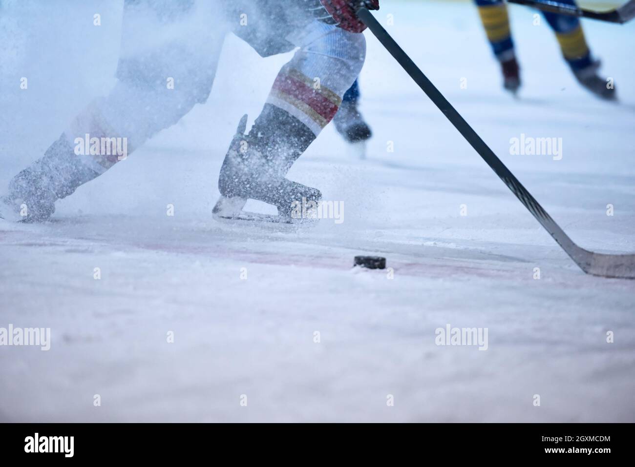 ice hockey player in action kicking with stick Stock Photo - Alamy