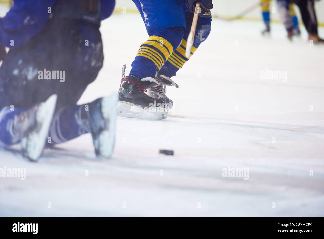 ice hockey player in action kicking with stick Stock Photo - Alamy