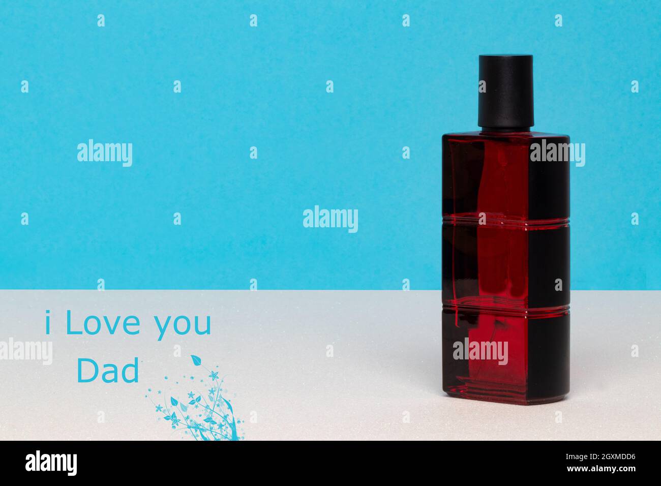 Happy father's day card. Close-up of red male parfum bottle on bright ...
