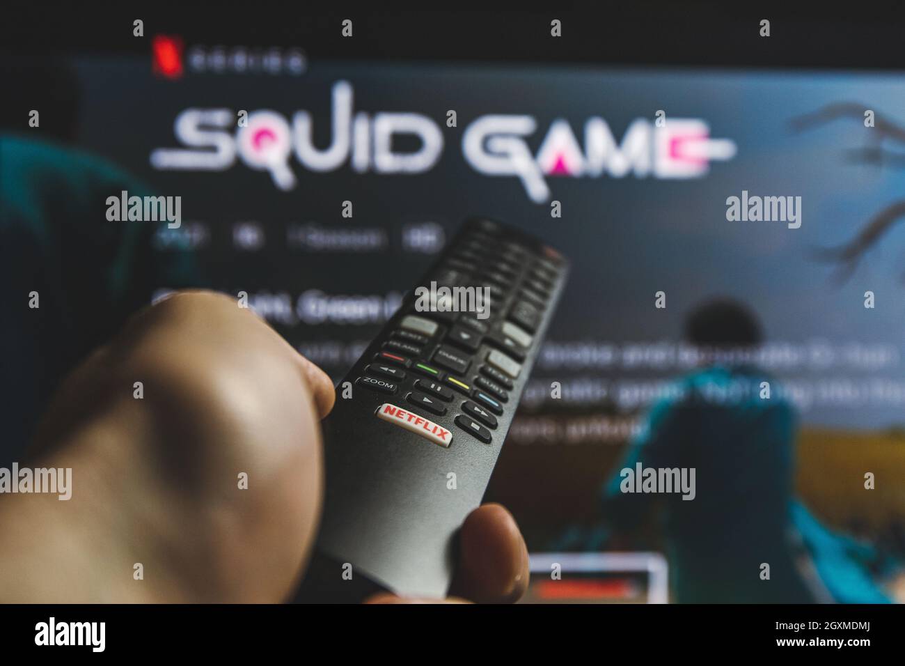 Watching Squid game show on TV. Squid game is a South Korean survival ...