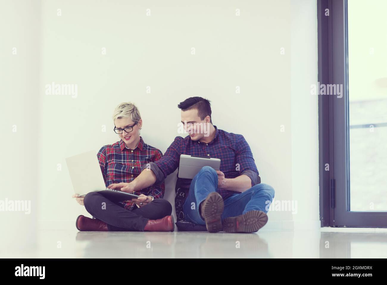 startup business and new mobile technology concept with young couple in ...