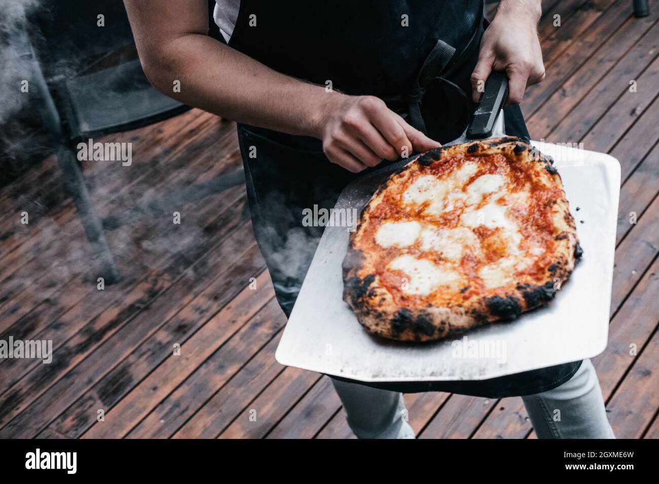 Cooking pizza in garden Stock Photo - Alamy