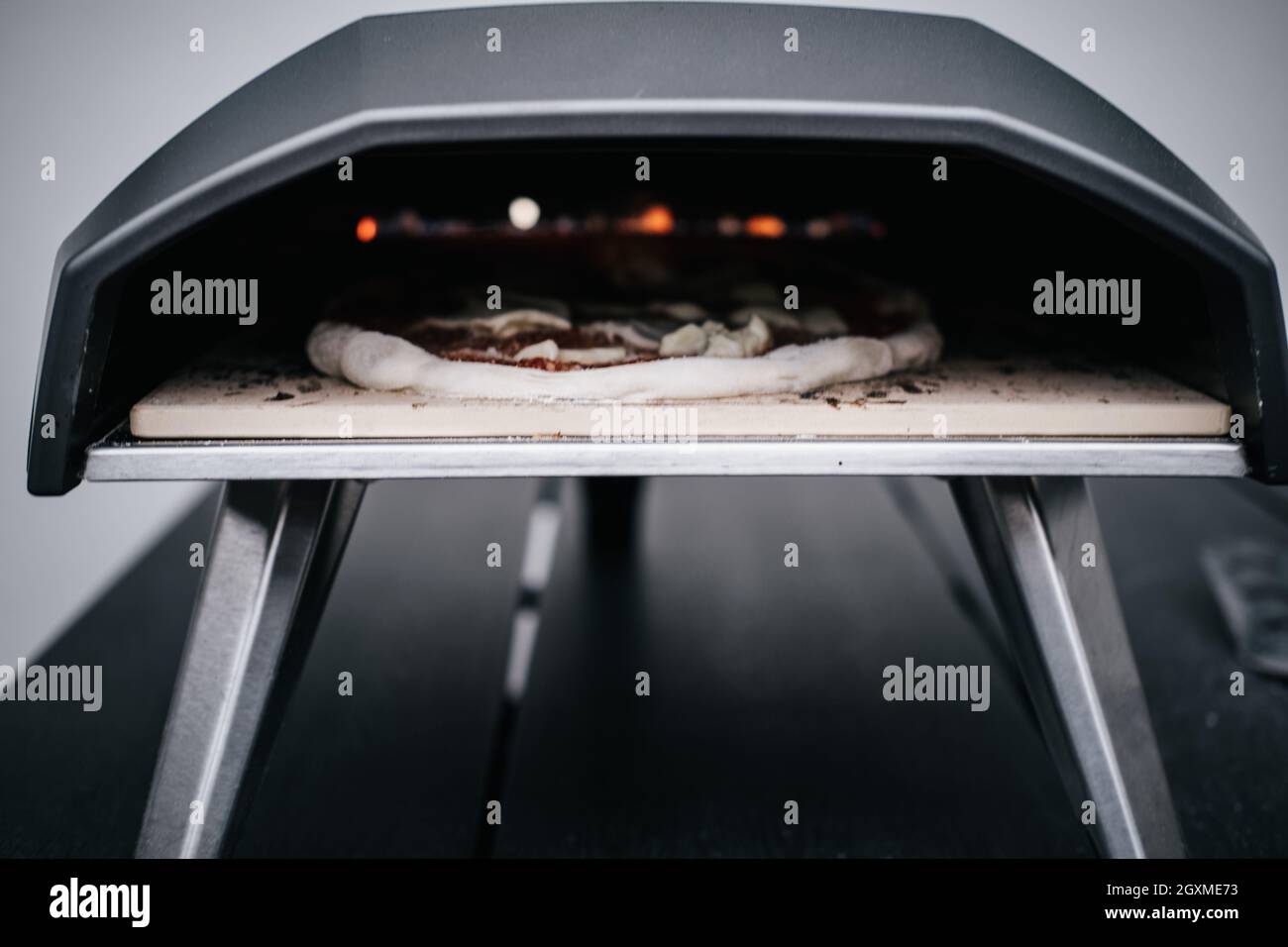 Cooking pizza in garden Stock Photo - Alamy
