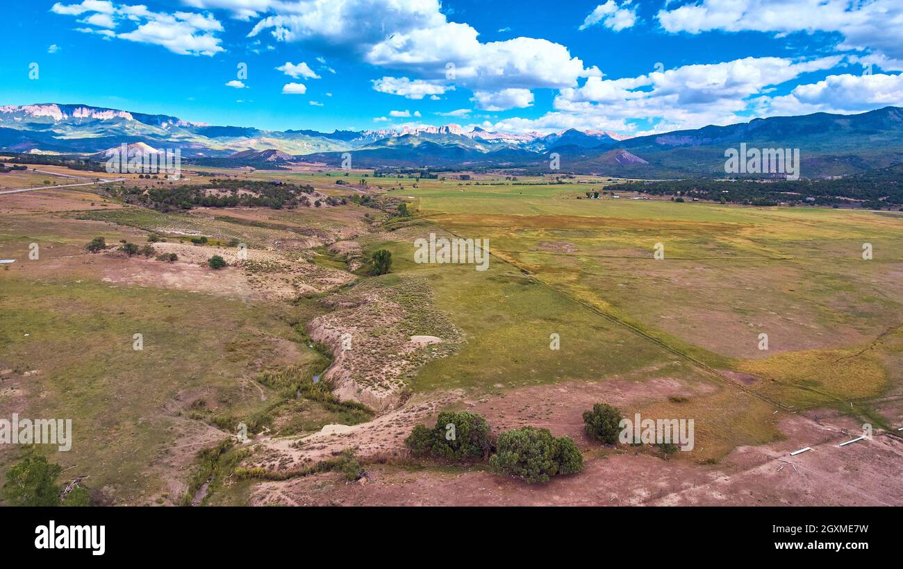 Large field of desert with beautiful mountain range in background Stock ...