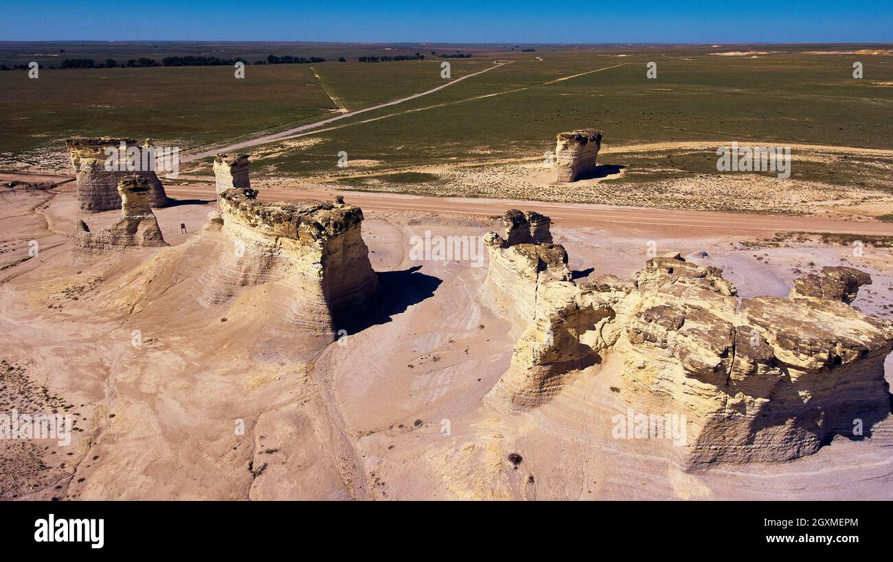 Aerial view of desert road with pillars of white rock in unusual ...