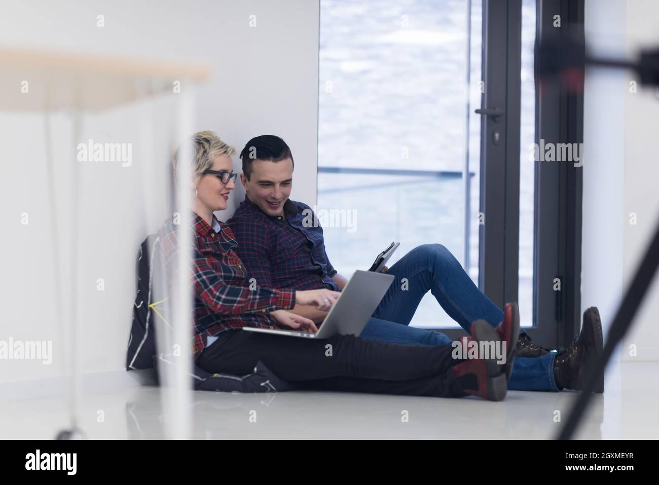 startup business and new mobile technology concept with young couple in ...