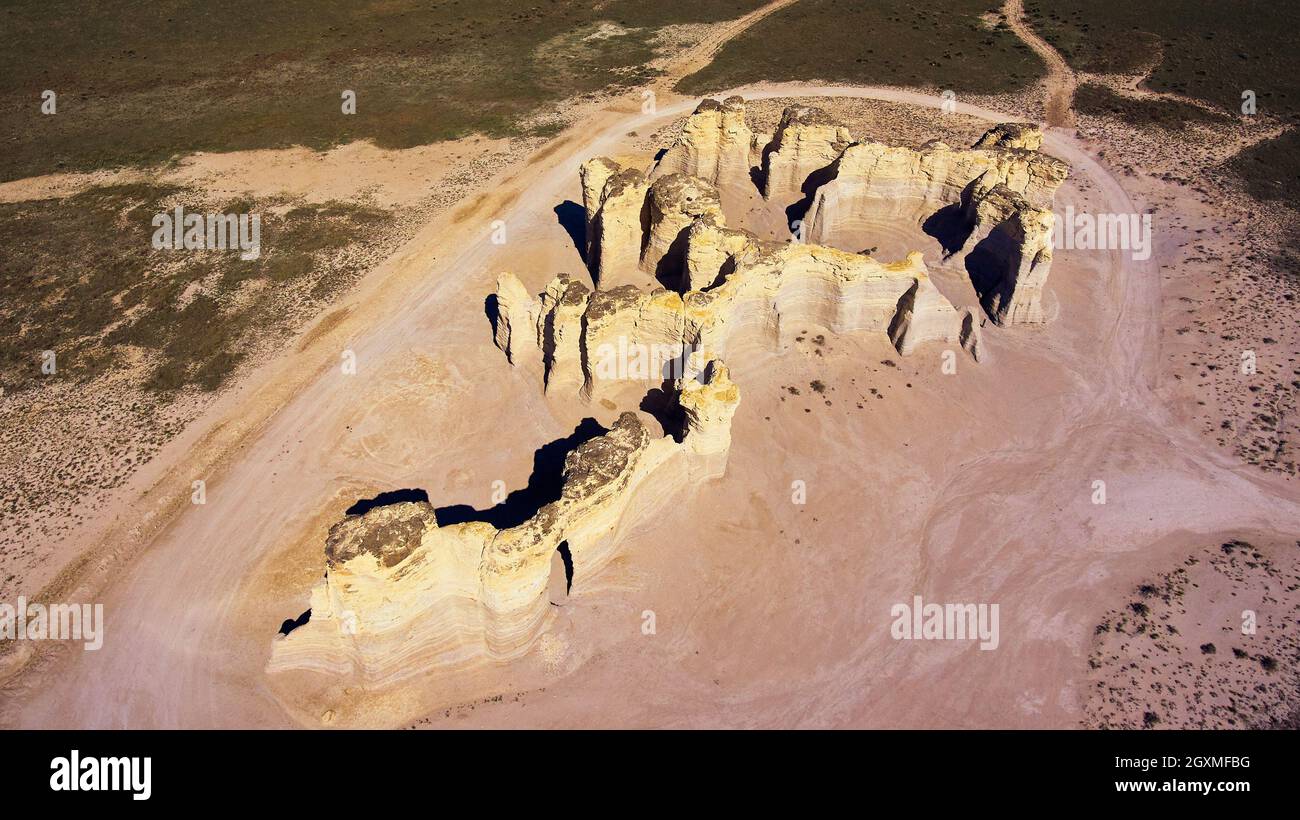 Obelisk rock structures sticking out of flat desert region Stock Photo ...