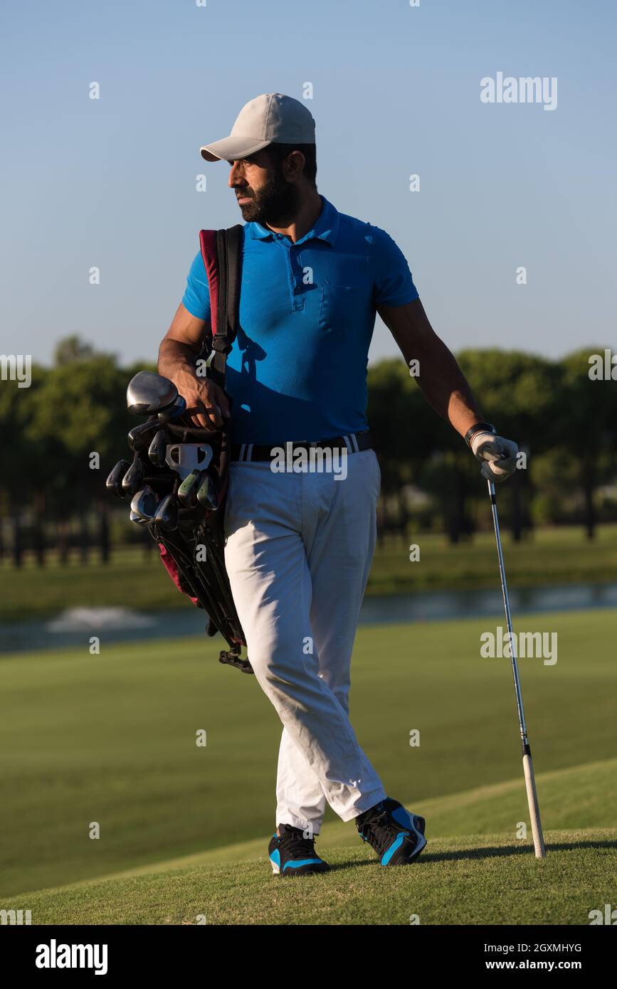 handsome middle eastern golf player portrait at course at sunny day ...