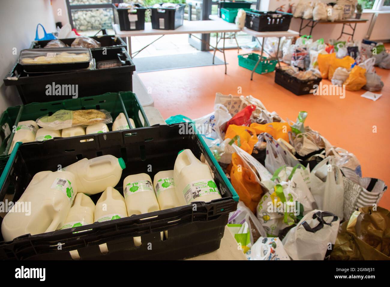 Bags and crates of food and drink donations, at a food bank ready for ...