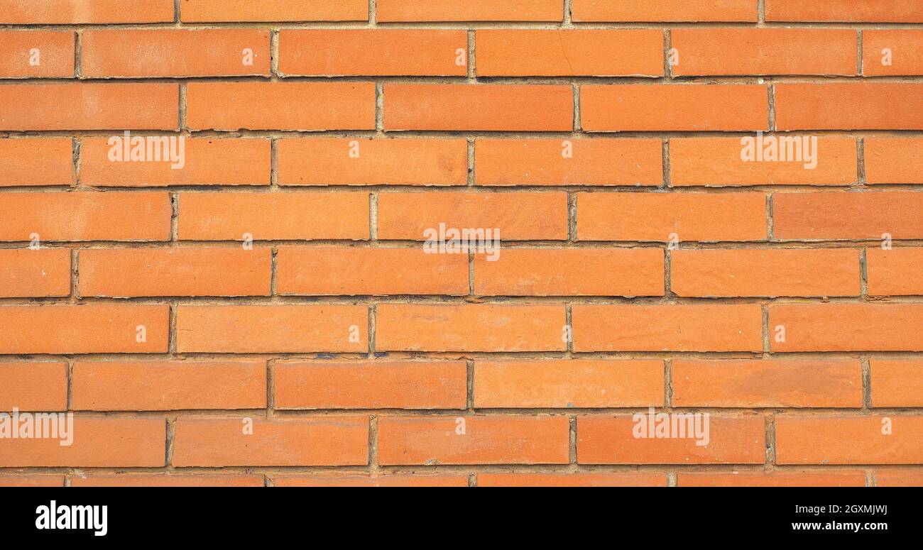 wide 4K red brick wall useful as a background Stock Photo - Alamy