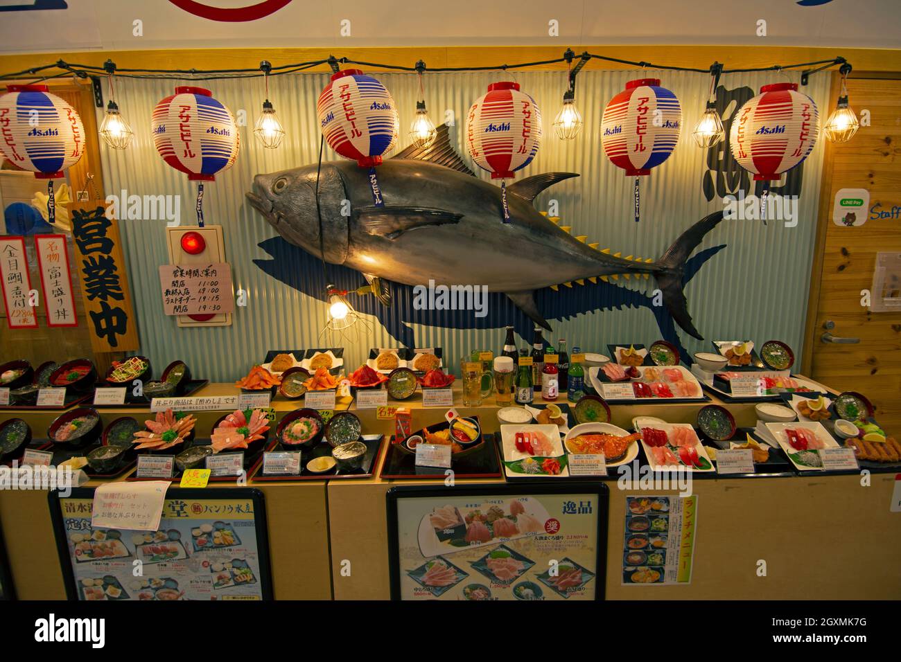 Waxed food display in front of a tuna sculpture in a sushi restaurant ...