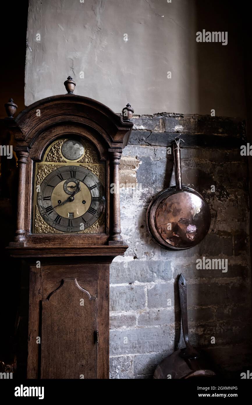 Grandfather clock in the kitchen of an historic English manor house ...