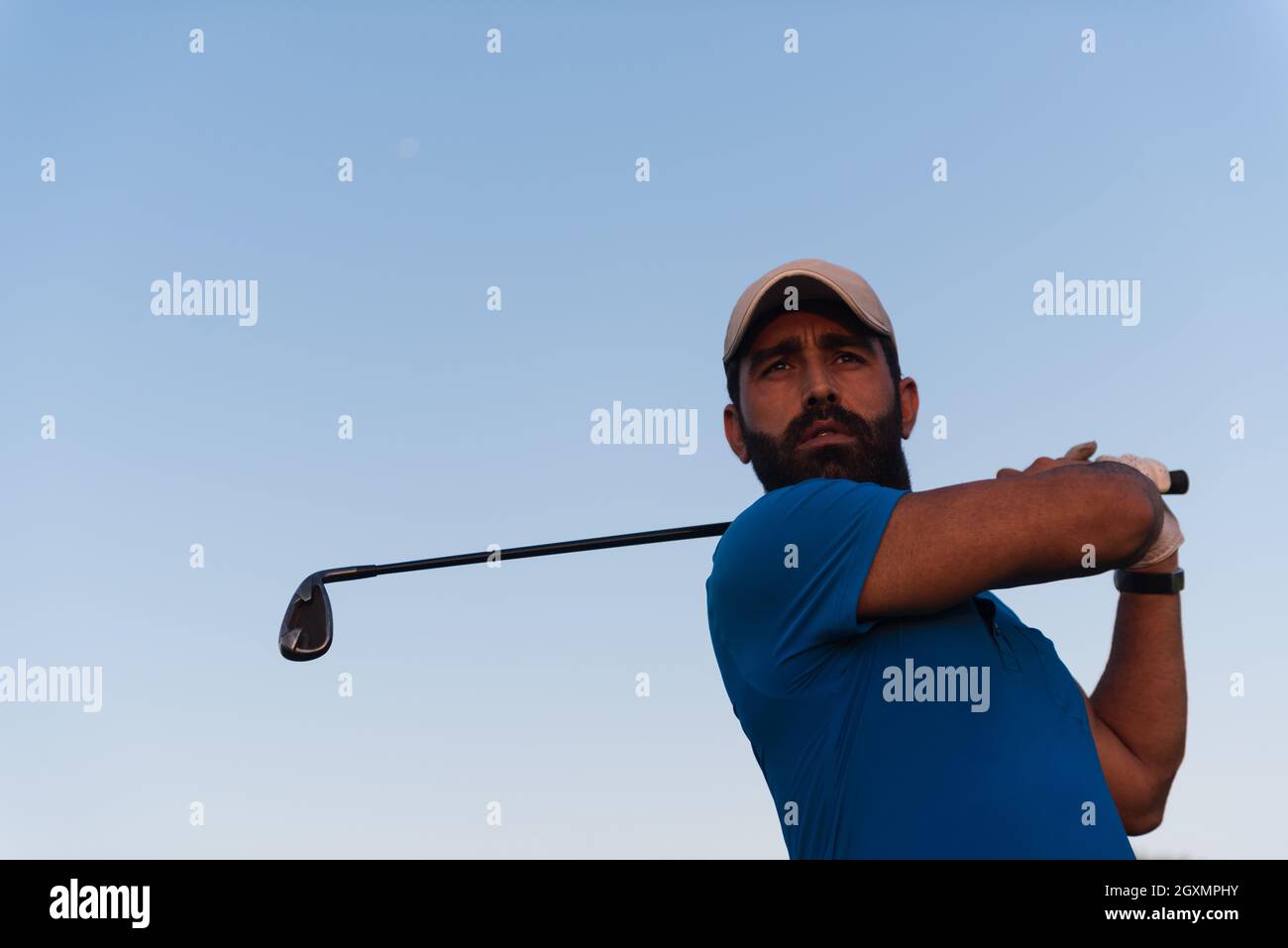 handsome middle eastern golfer portrait at golf course at beautiful ...