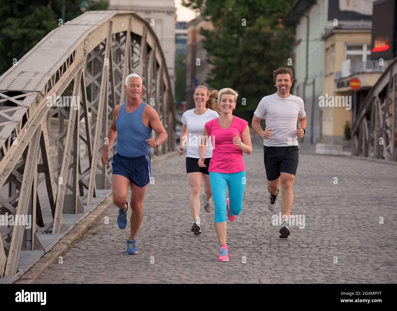 people group jogging runners team on morning training workout with ...