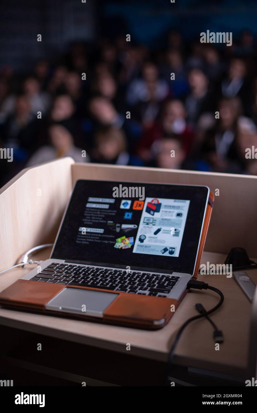 laptop computer at podium on business seminar education in modern ...