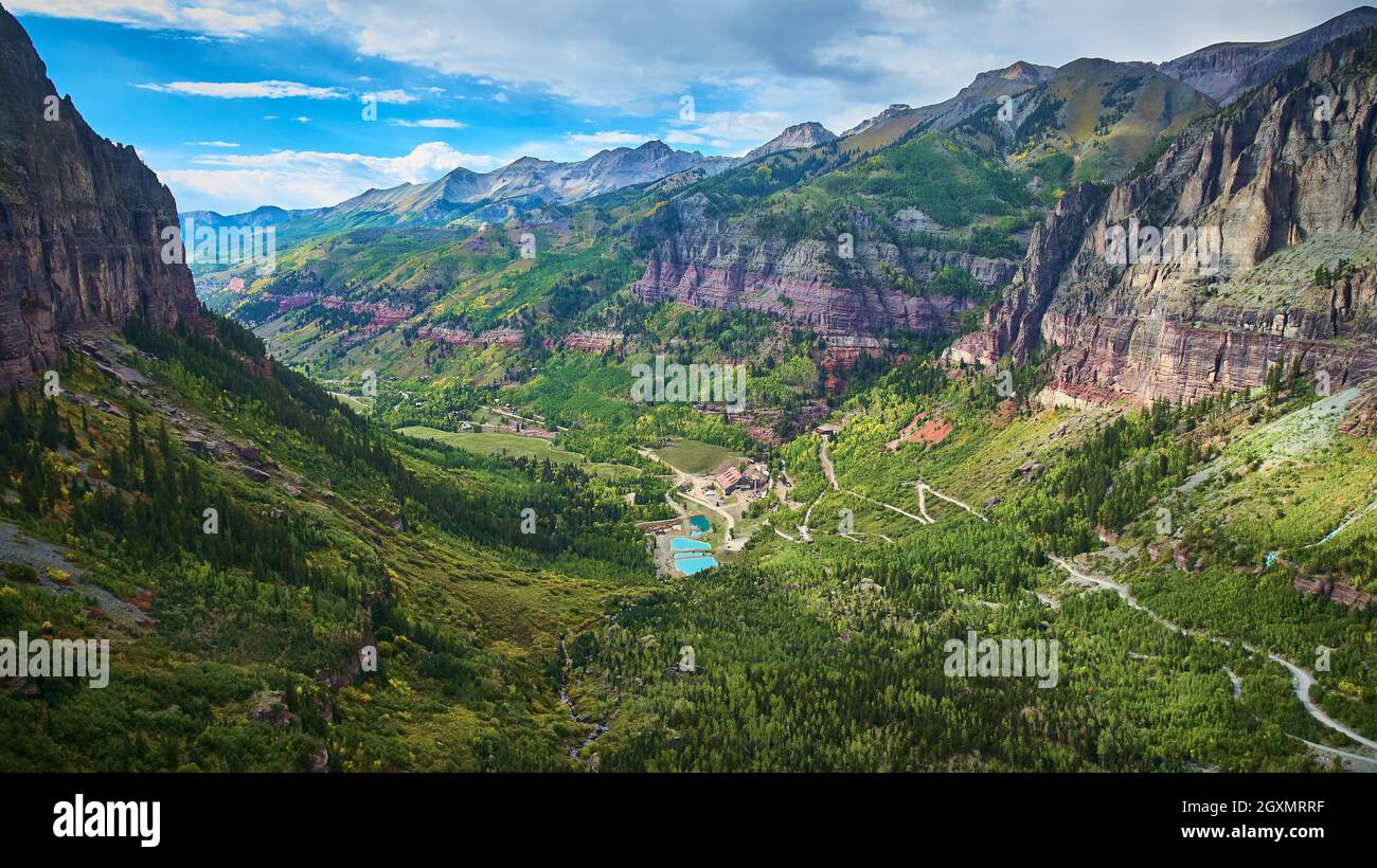 Mountain chain with valley filled with aspen Stock Photo - Alamy