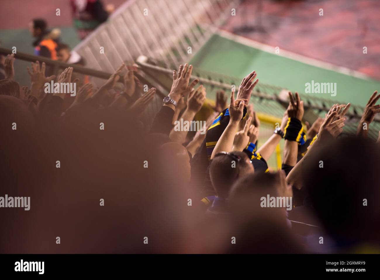Football fans hands clapping while supporting their team on the podium ...