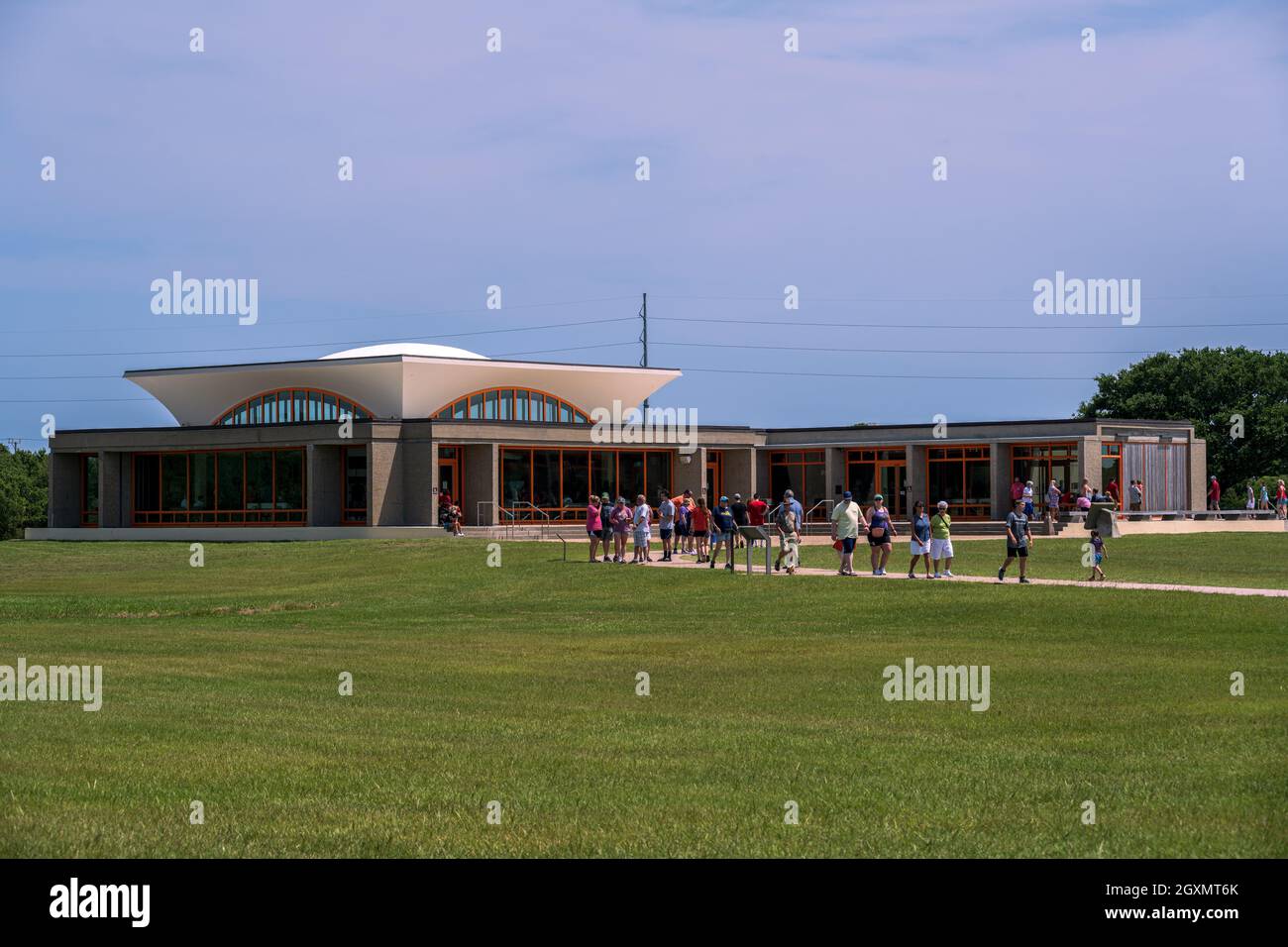 Kitty Hawk, NC, USA -- July 27, 2021. Tourists head for the Kitty Hawk ...