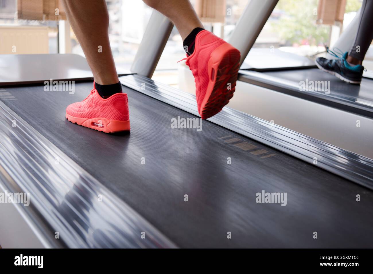 healthy yung sportsman exercise jogging on treadmill in fitness gym ...