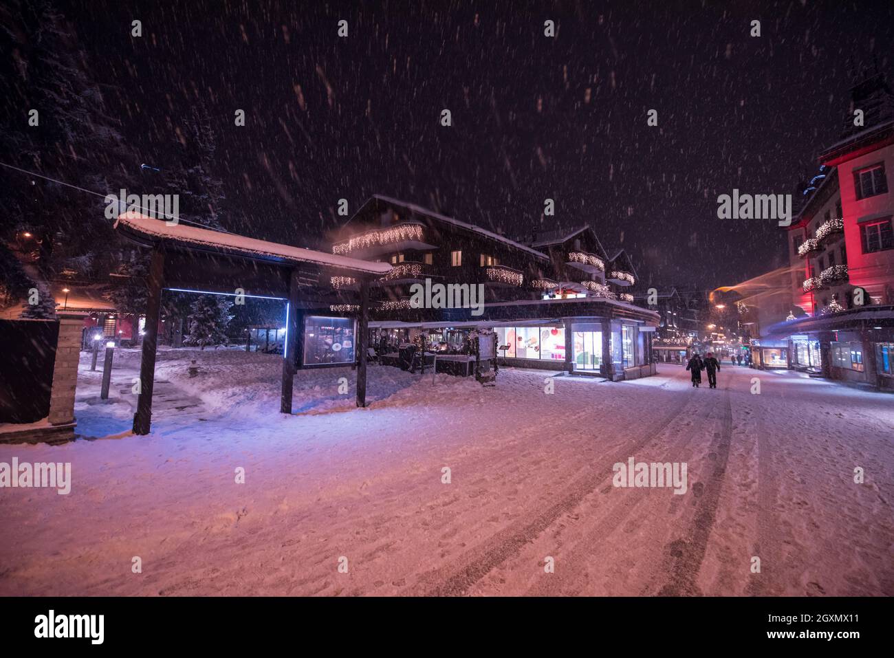 a view on snowy streets of the Alpine mountain village in the cold ...