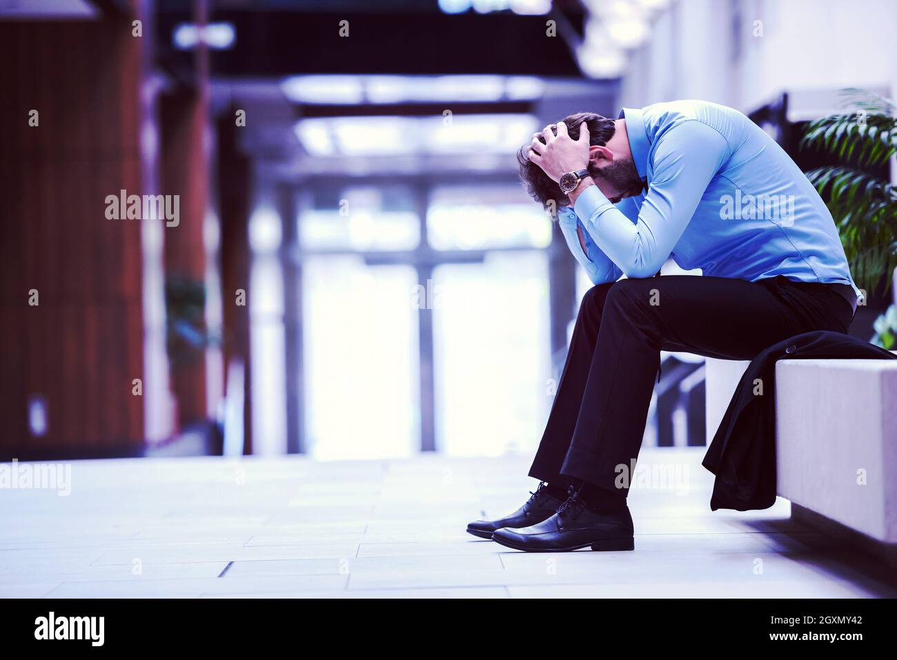 frustrated young business man working on laptop computer at office ...