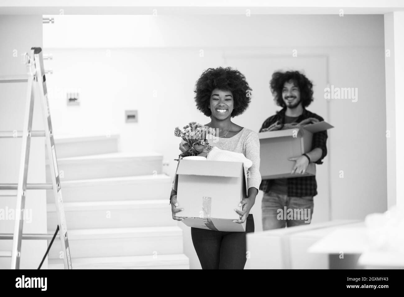 Unpacking boxes Black and White Stock Photos & Images - Alamy