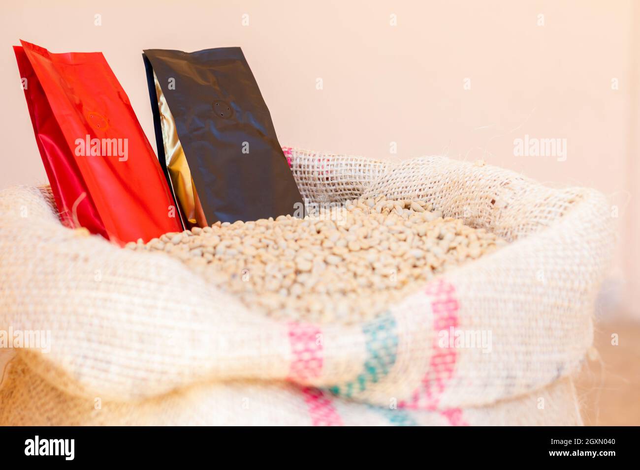 Bags buried in ready coffee beans. Sack full of coffee. Red, black and ...