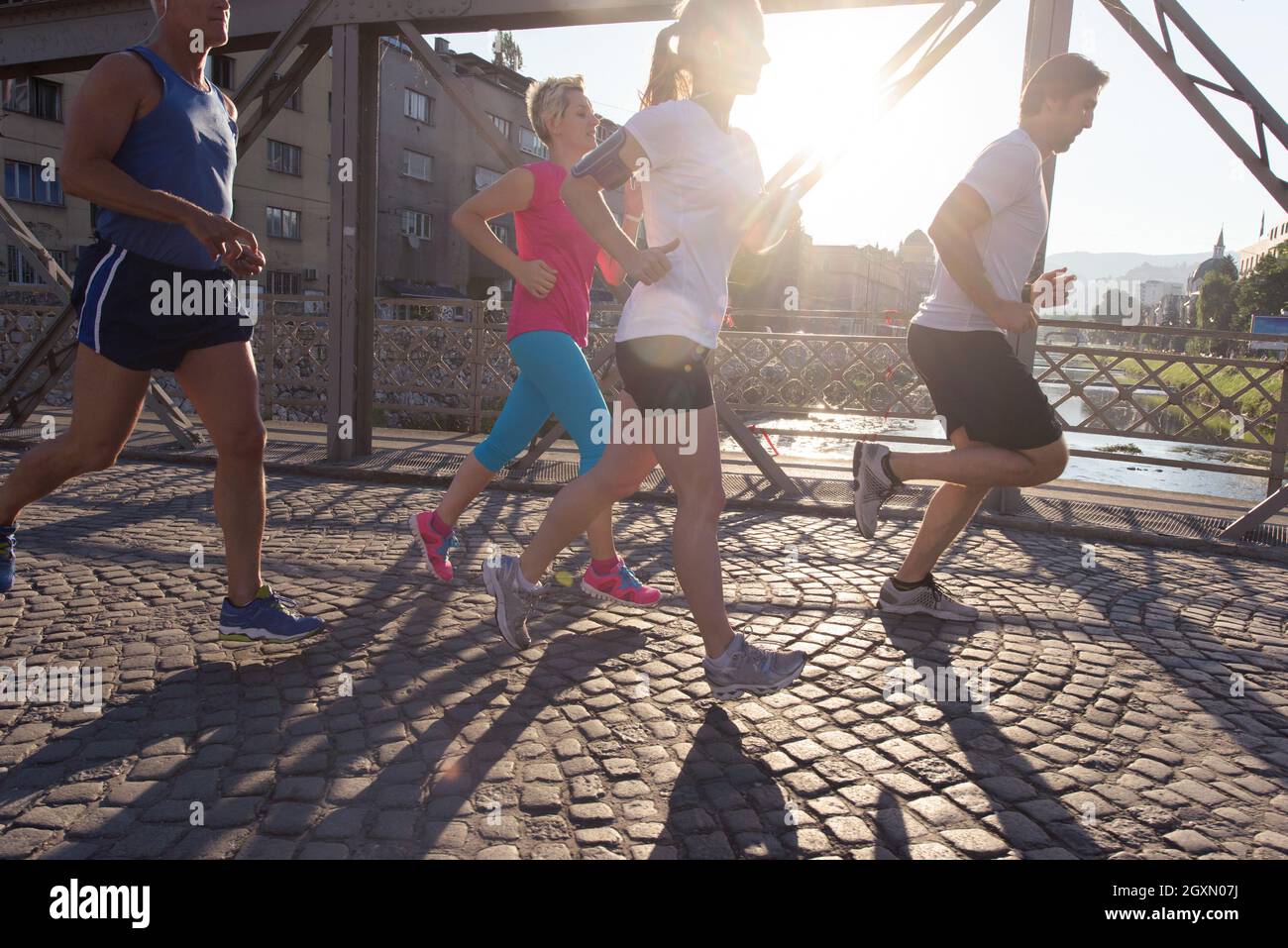 people group jogging runners team on morning training workout with ...