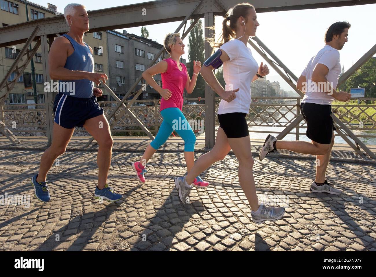 people group jogging runners team on morning training workout with ...