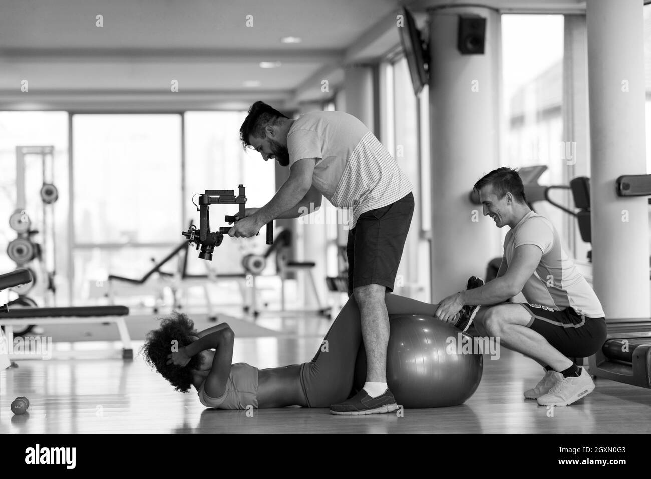 healthy young couple exercise in gym pilates workout with personal ...