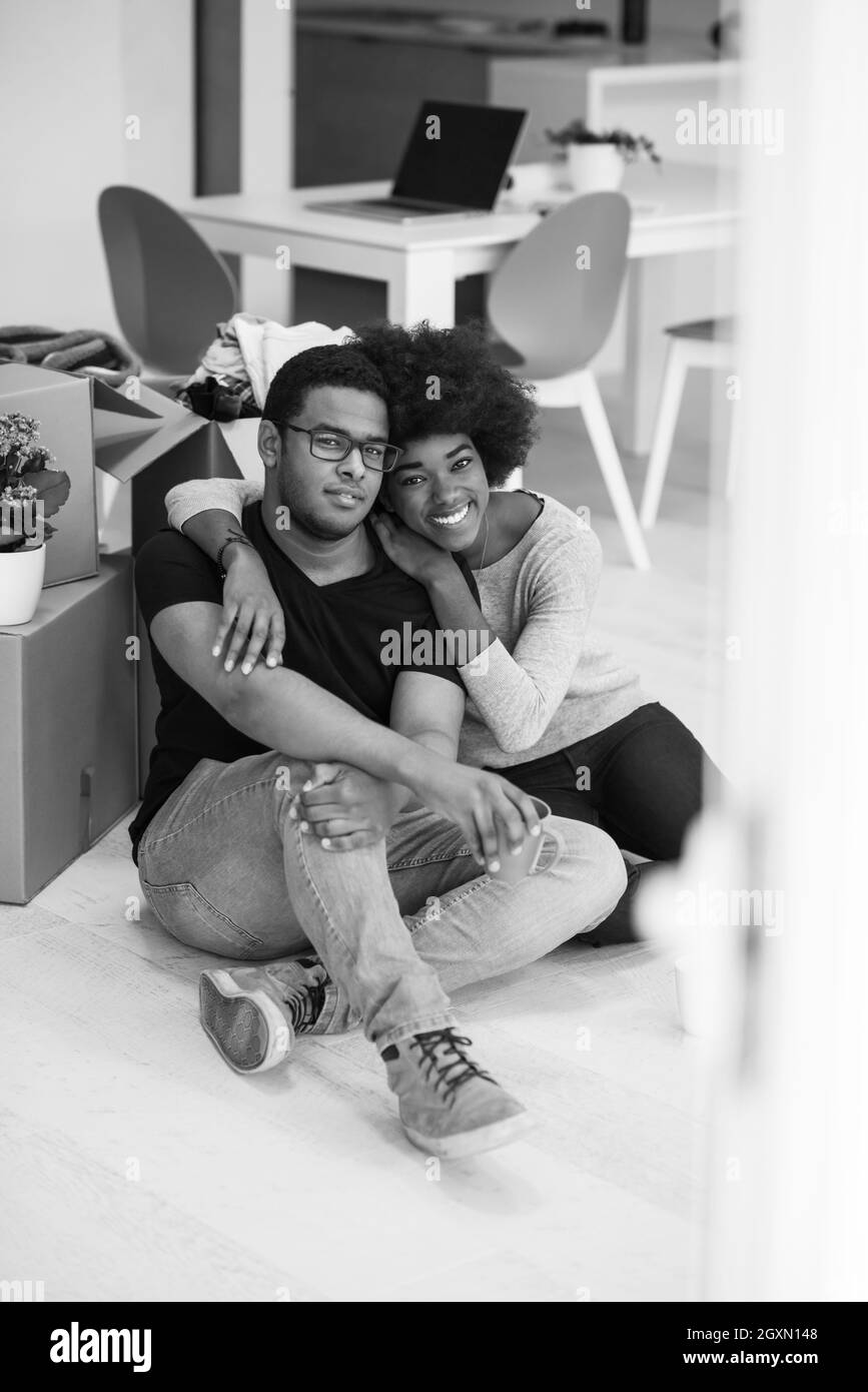 Cheerful young woman unpacking Black and White Stock Photos & Images ...