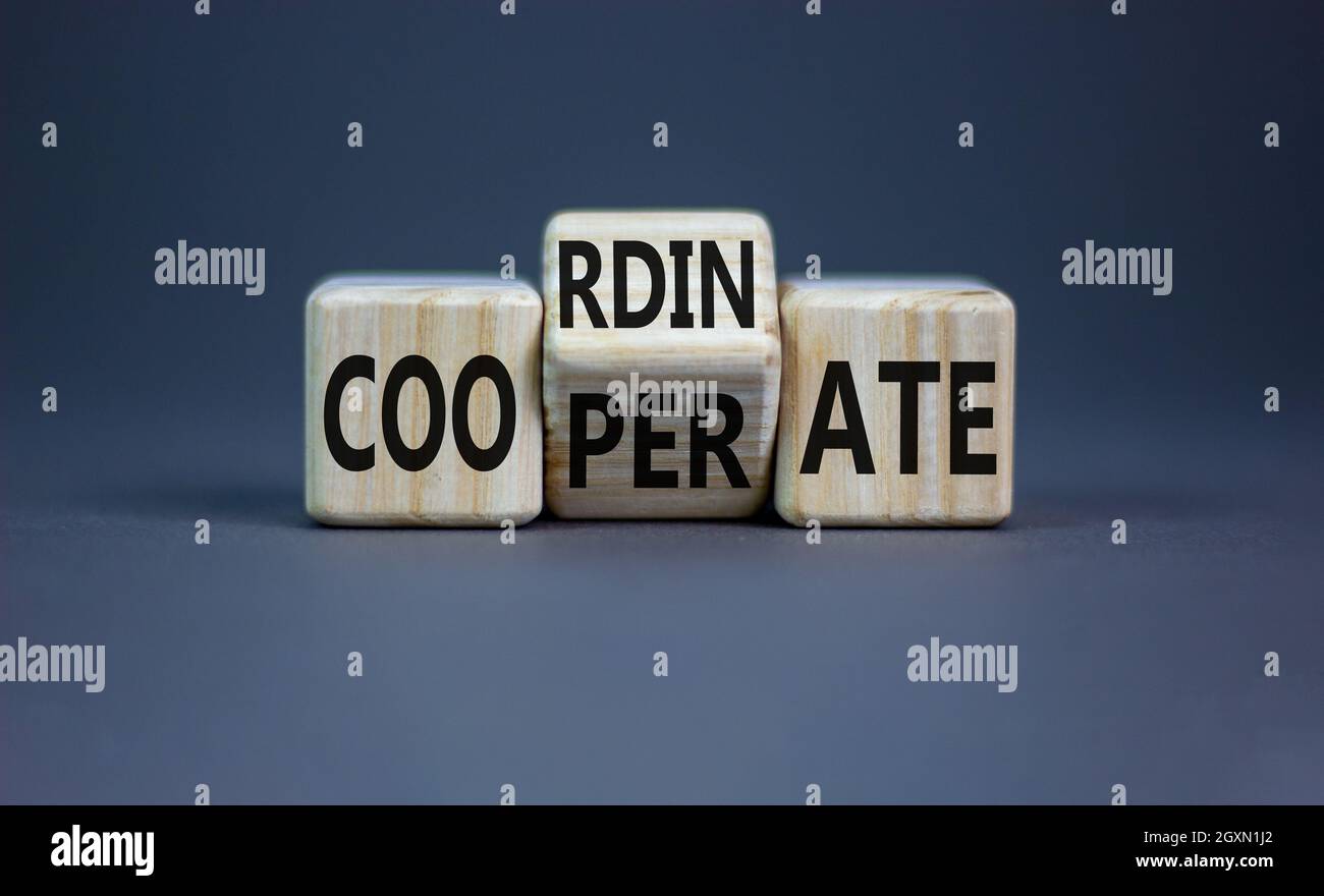 Coordinate and cooperate symbol. Turned wooden cubes and changed the ...