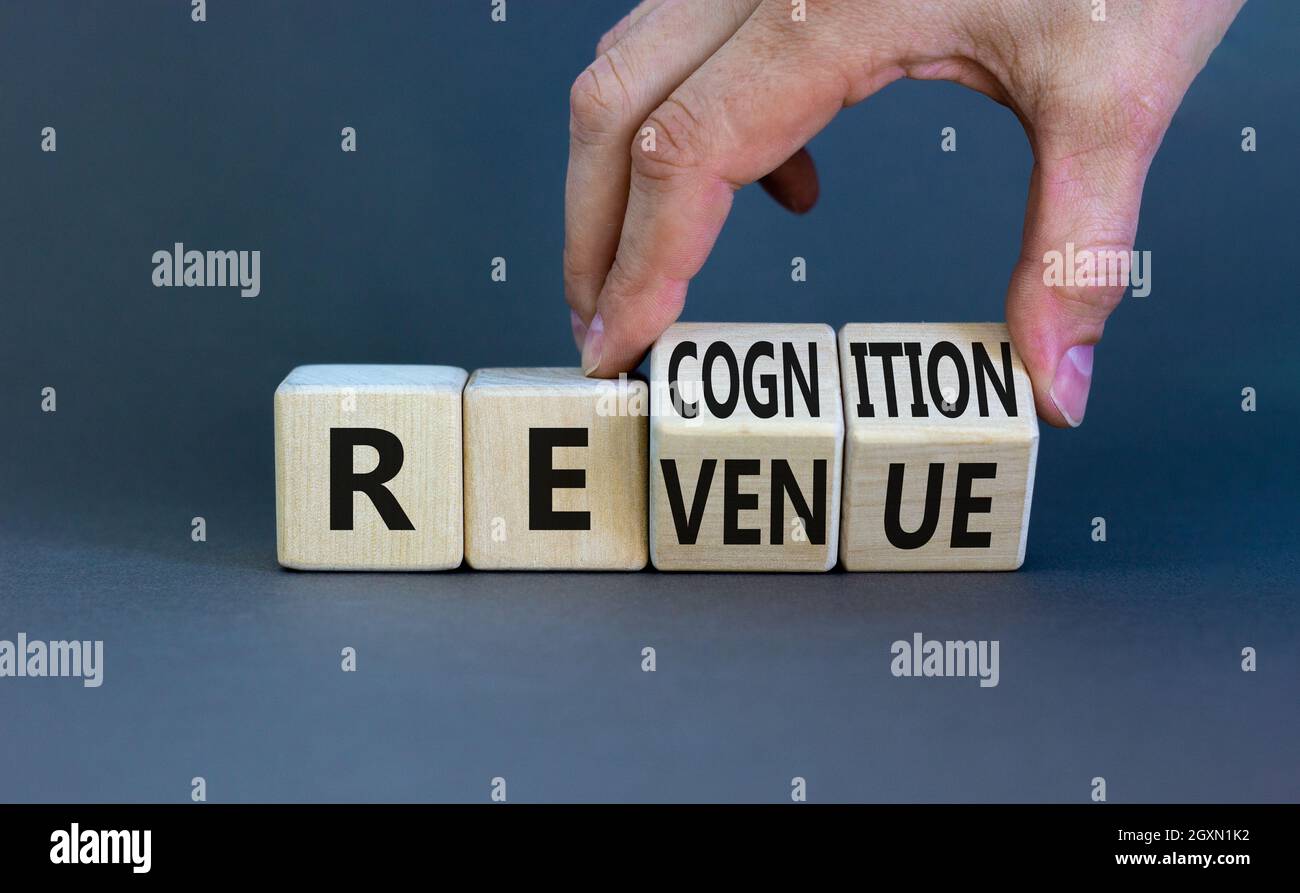 Revenue and recognition symbol. Businessman turns cubes and changes the ...