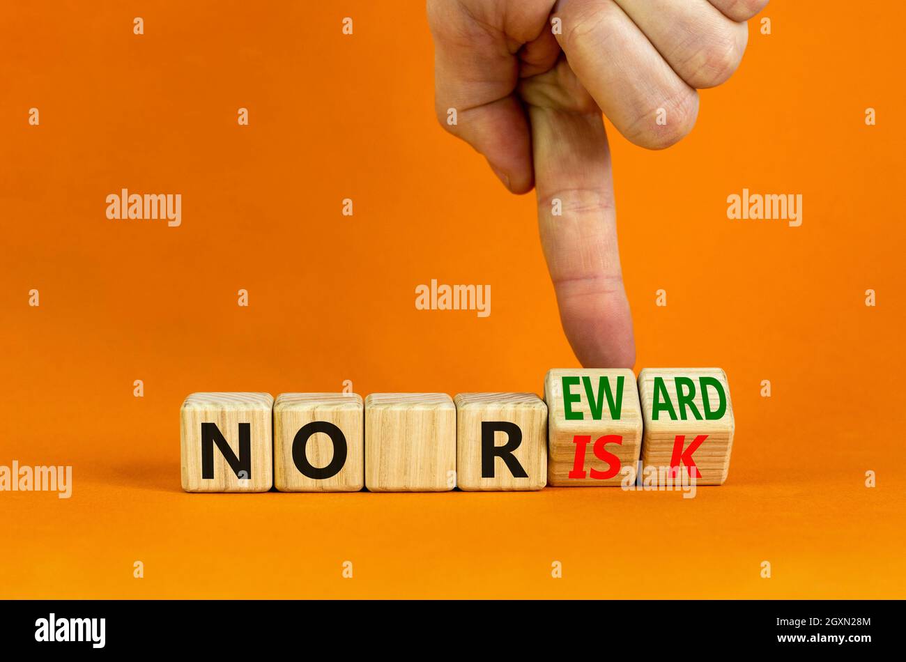 No risk and reward symbol. Businessman turns wooden cubes and changes ...