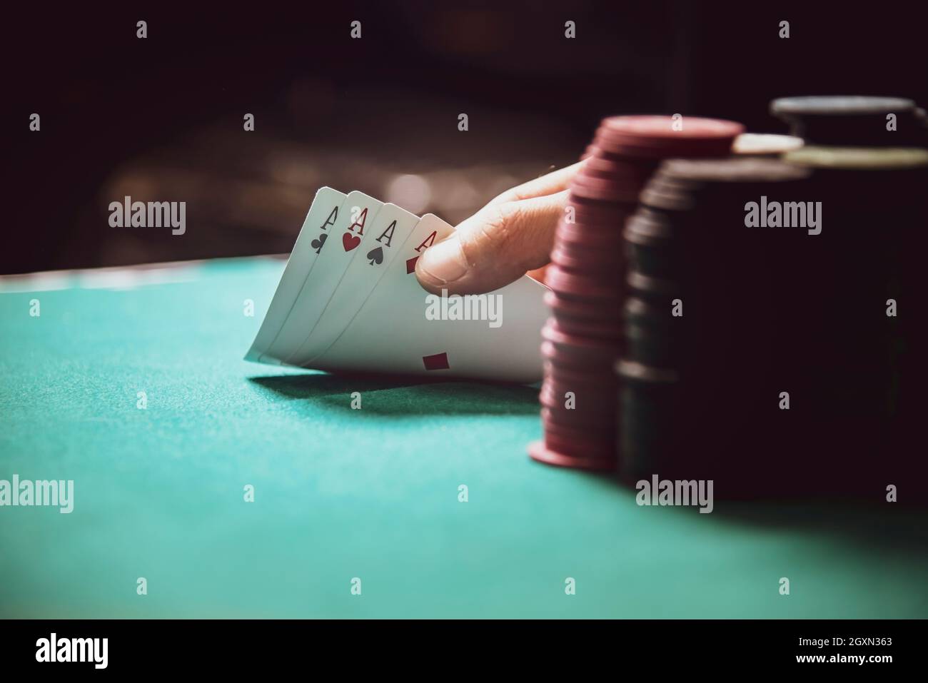 man winning at poker, showing the 4 aces in his hand Stock Photo - Alamy