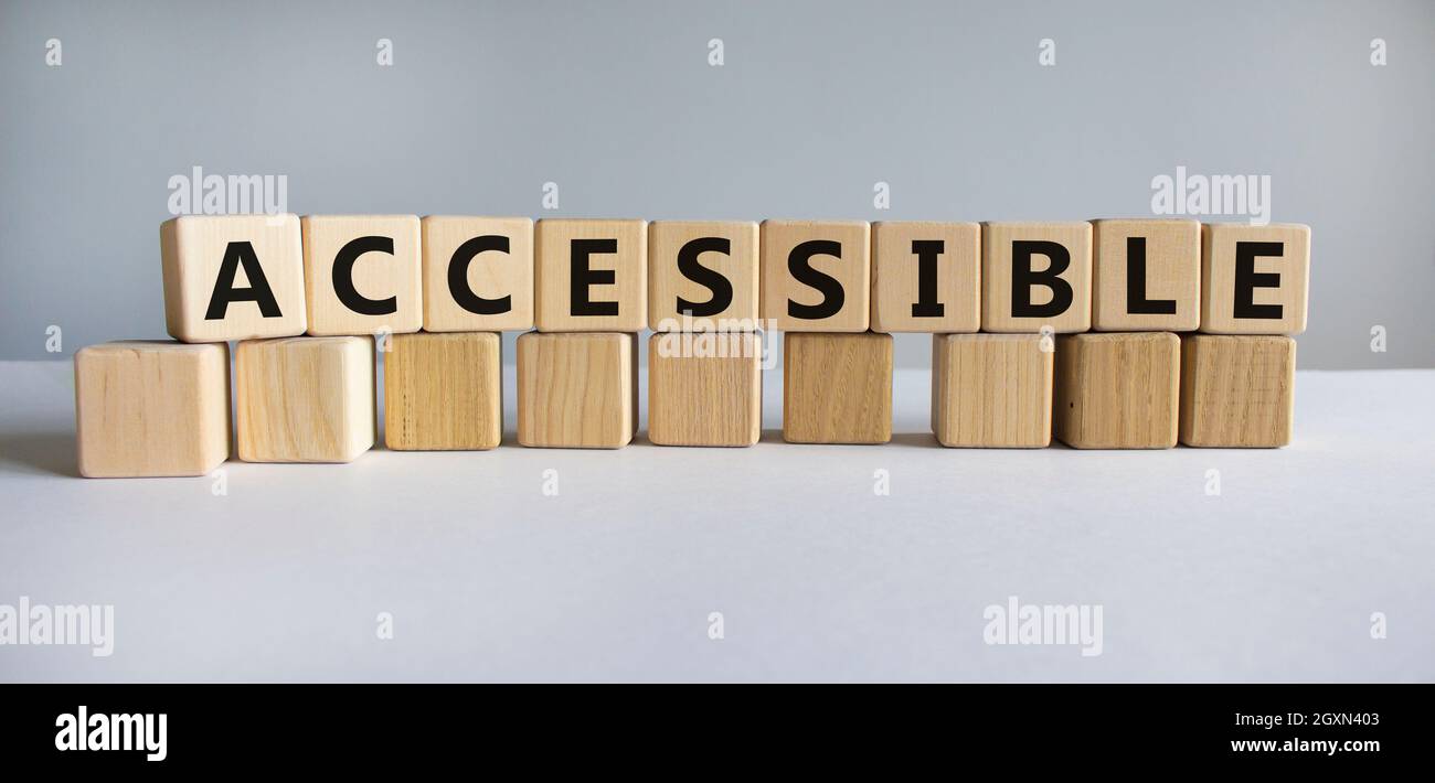 Accessible symbol. The word accessible on wooden cubes. Beautiful white ...