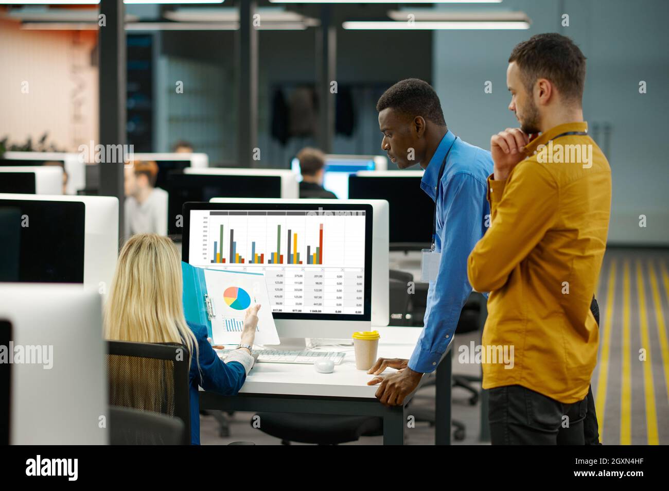 Business team looks digital hi-res stock photography and images - Alamy