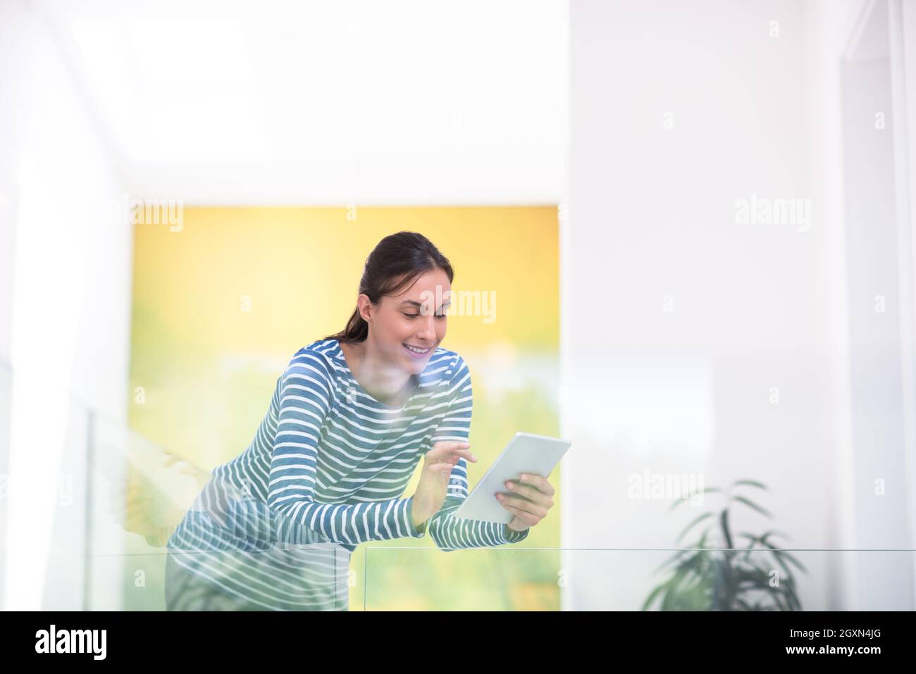 beautiful young woman at home websurfing on internet with tablet Stock ...