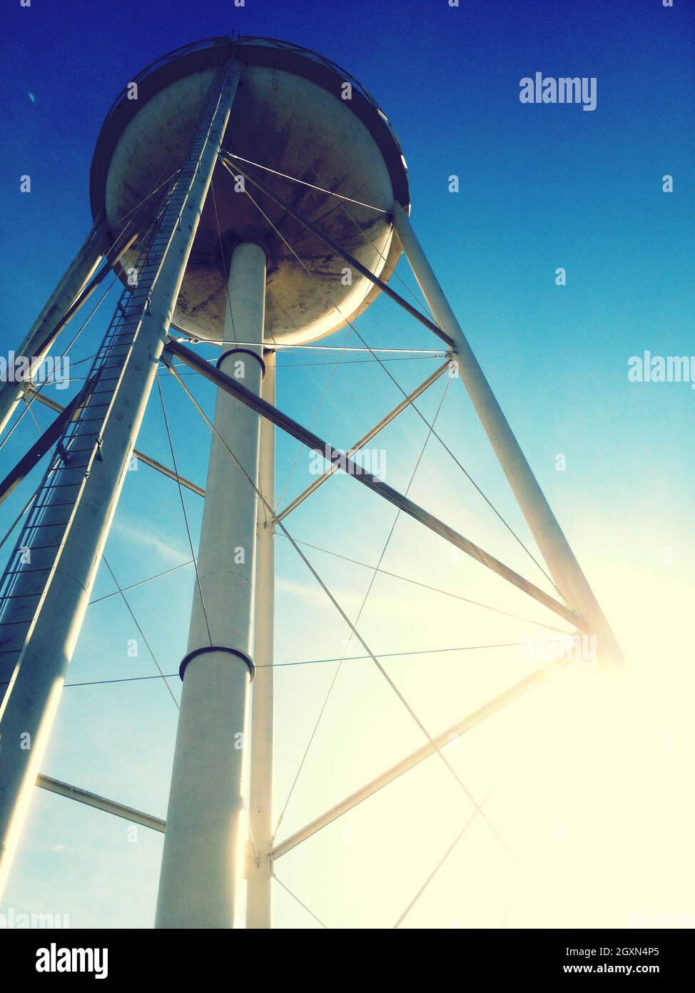 Worm's eye view of a water tower against a blue sky Stock Photo - Alamy