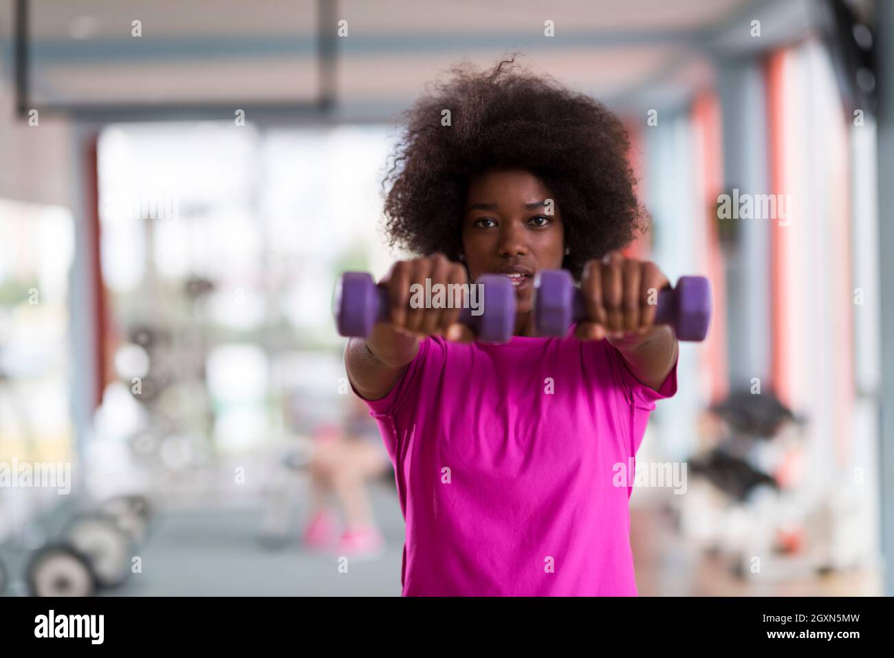 happy healthy african american woman working out in a crossfit gym on ...