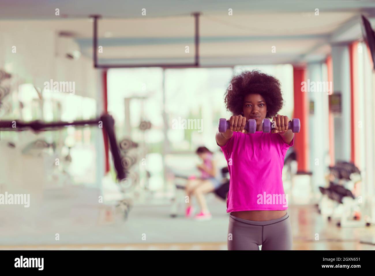 happy healthy african american woman working out in a crossfit gym on ...