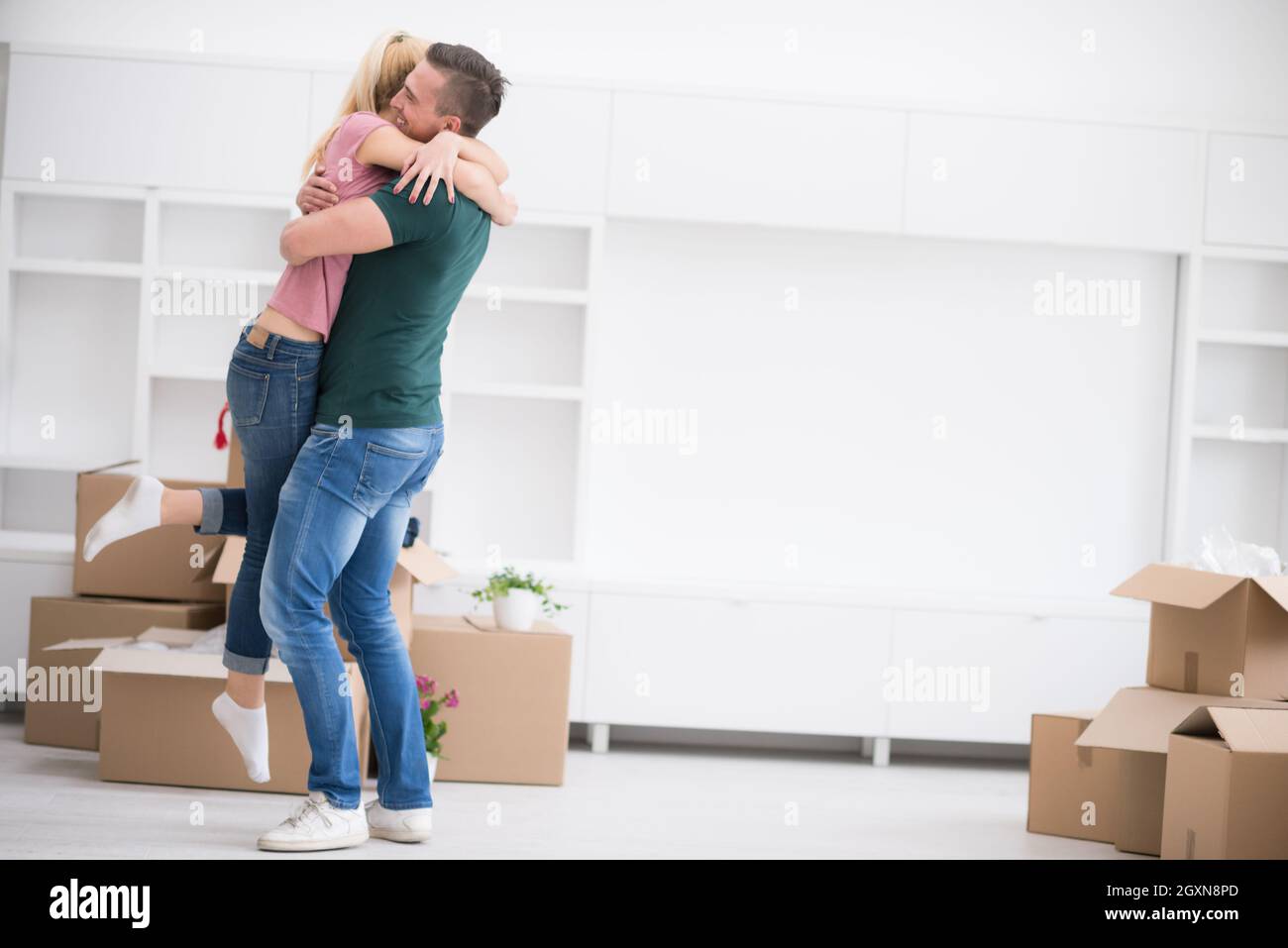 excited happy young couple looking forward to moving into a new home ...