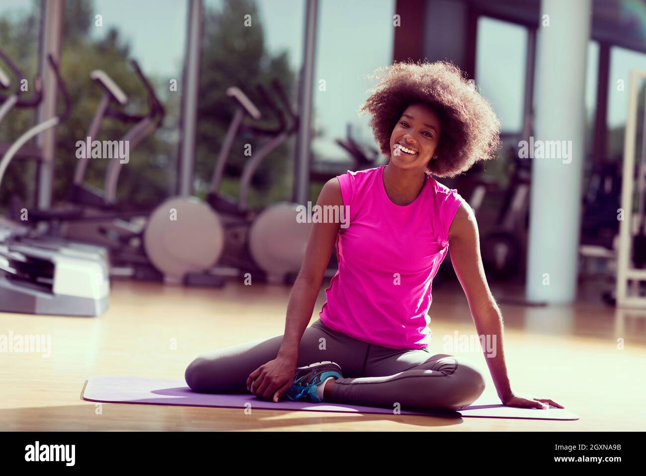 beautiful young african american woman exercise yoga in gym Stock Photo ...